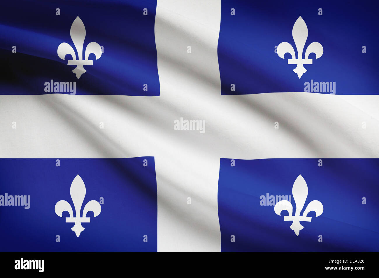 Quebec flag blowing in the wind. Part of a series Stock Photo - Alamy