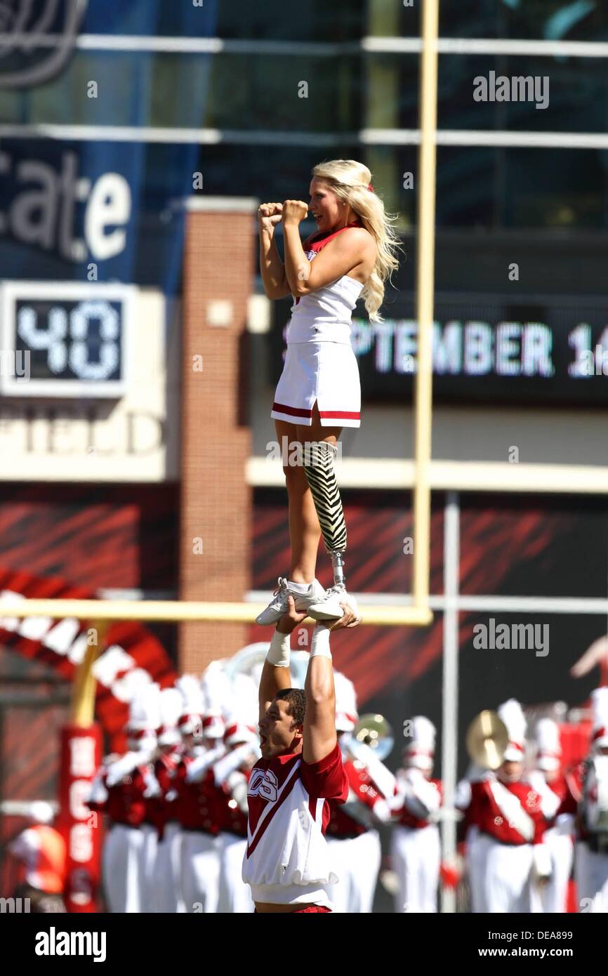 Sept. 14, 2013: A member of the Razorback cheer leading group calls the ...