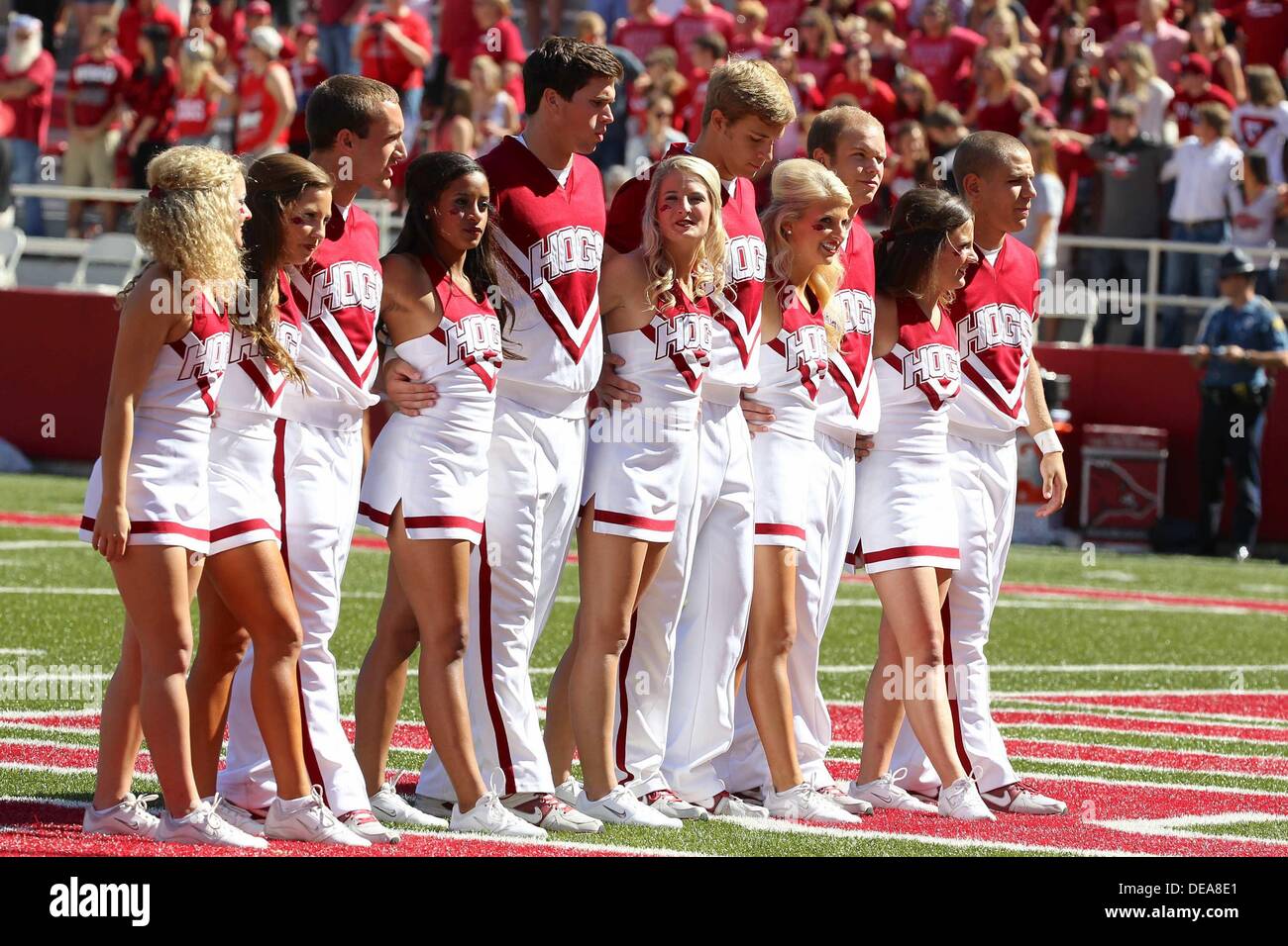 Sept. 14, 2013: Members of the Razorback cheer leaders line up to sign ...
