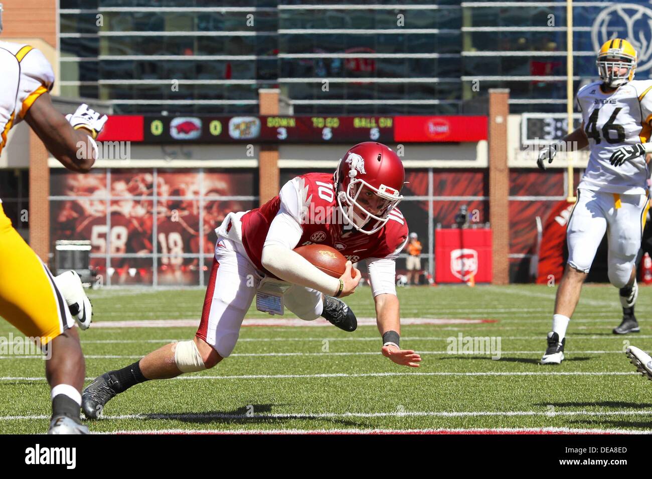 Sept. 14, 2013: Razorback QB Brandon Allen #10 drives into the end zone ...