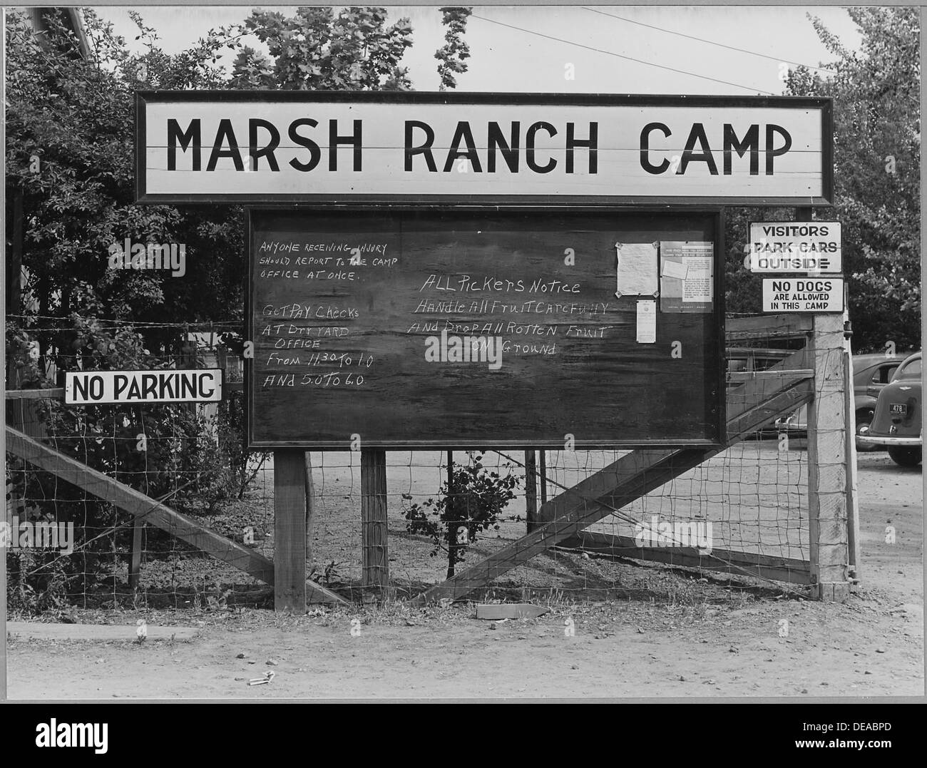 This image shows the entrance to a labor camp on a large-scale fruit ...