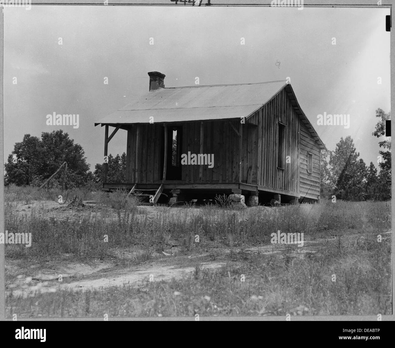 A photograph of abandoned farm shacks located on government ...