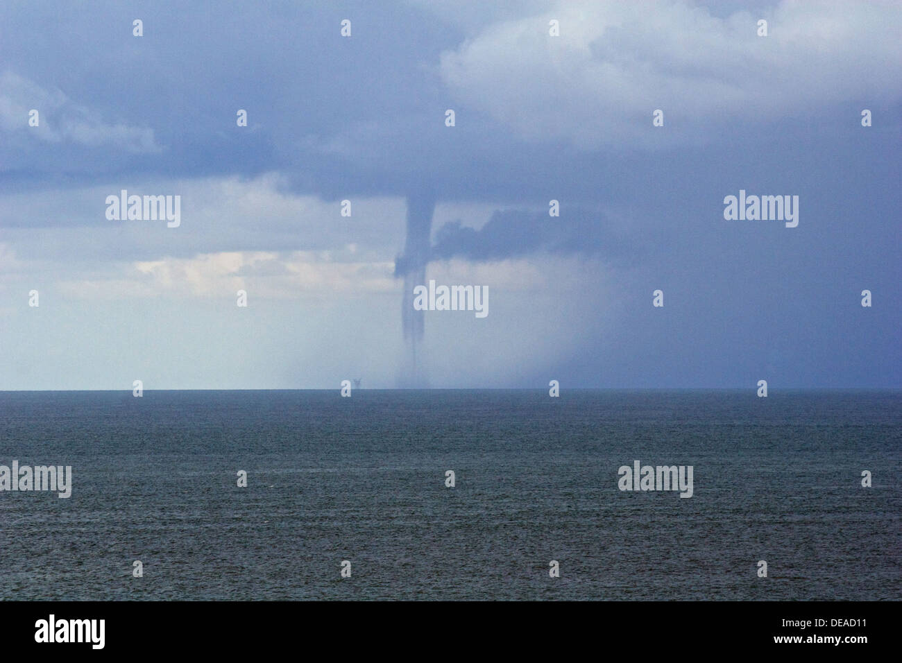 Waterspout forming over an oil rig in the gulf of Mexico, Atlantic ...