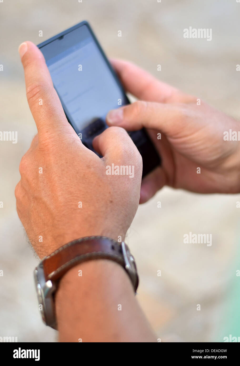 Close up of a man using mobile smart phone Stock Photo - Alamy