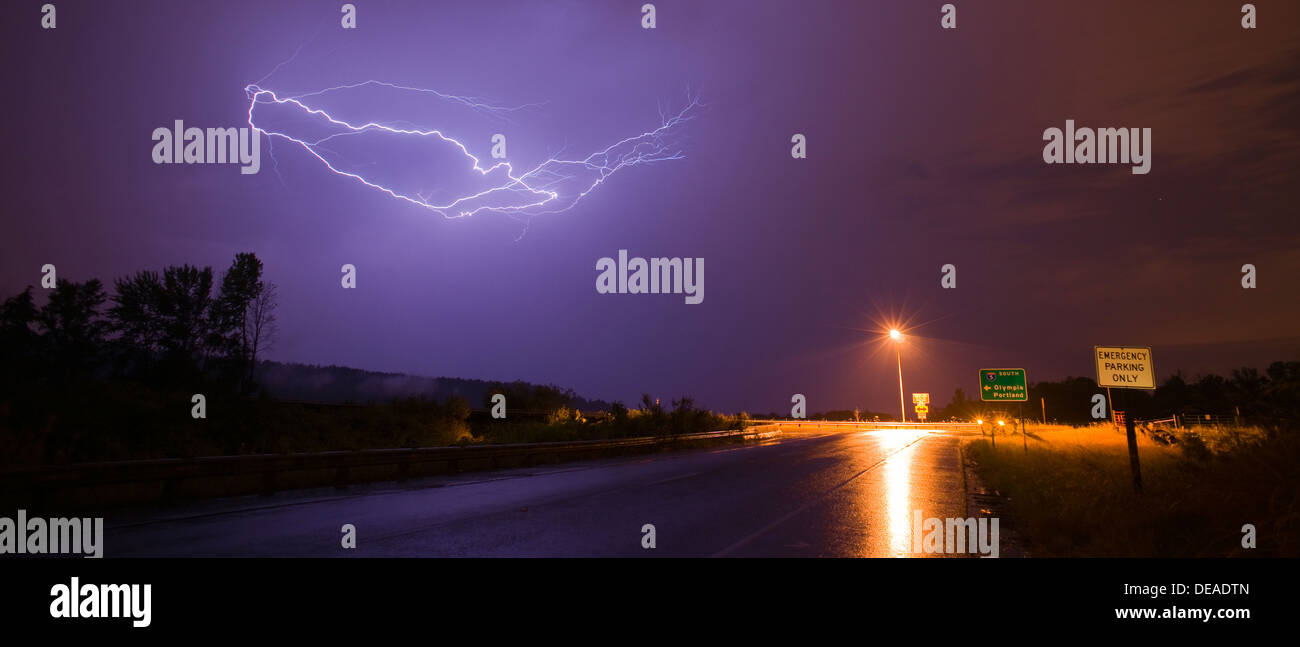 Lightning erupts over a lonely highway on ramp in Nisquallly Valley ...