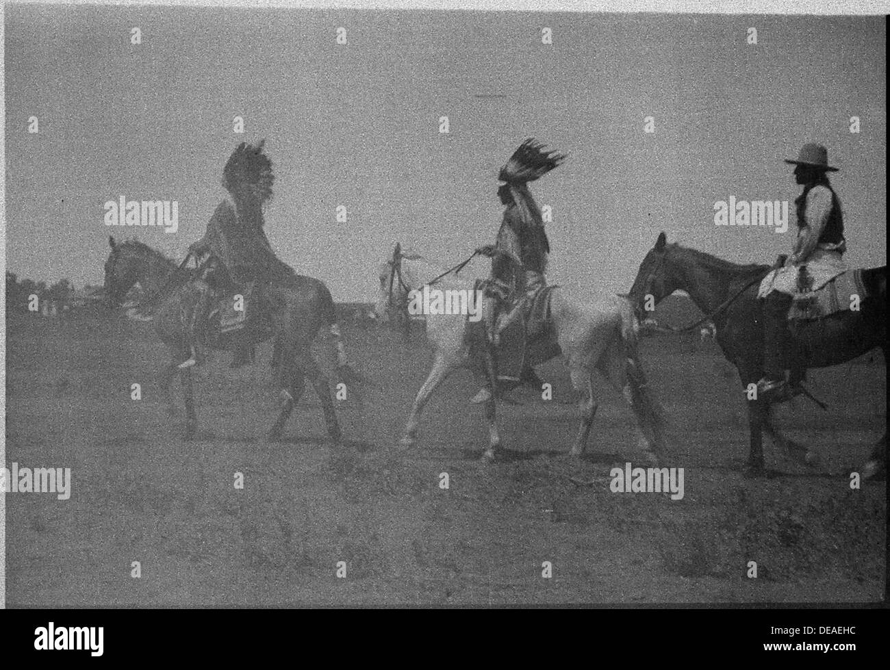 This photograph depicts Native American individuals on horseback ...