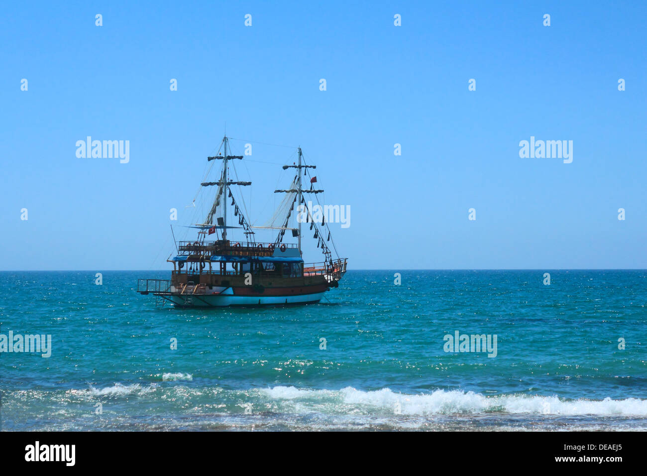 A small sailing vessel for sea trips near beach resort Stock Photo - Alamy