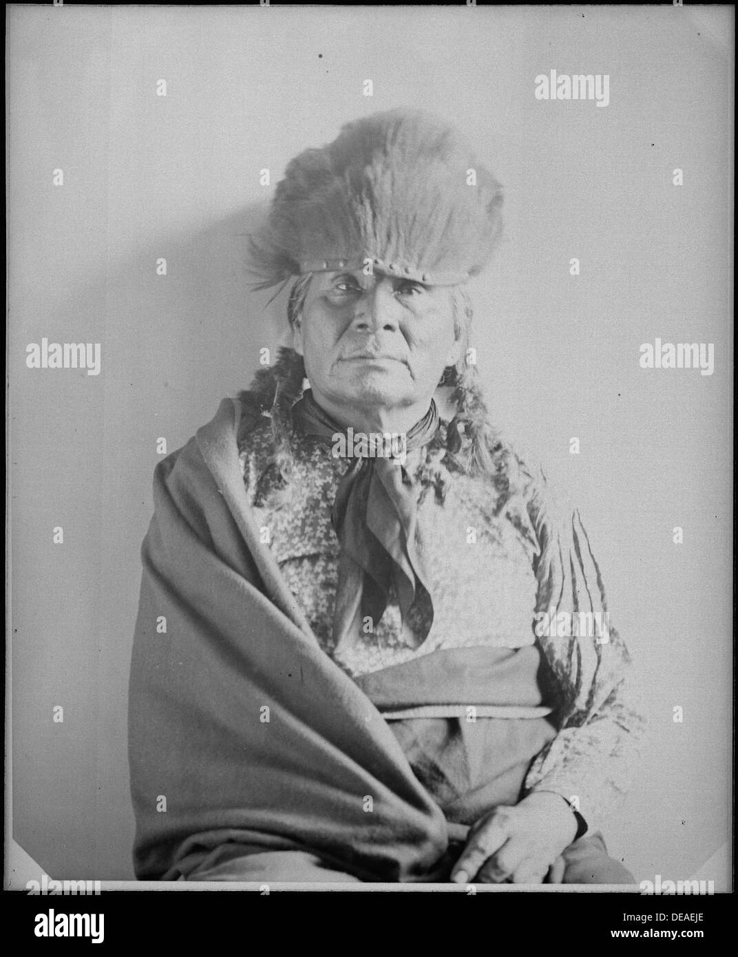 This image is a bust portrait of an Indigenous individual, reflecting ...