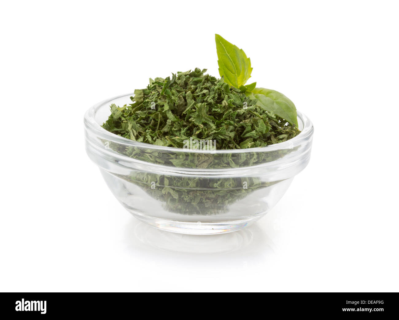 dried green spices in bowl isolated on white background Stock Photo - Alamy