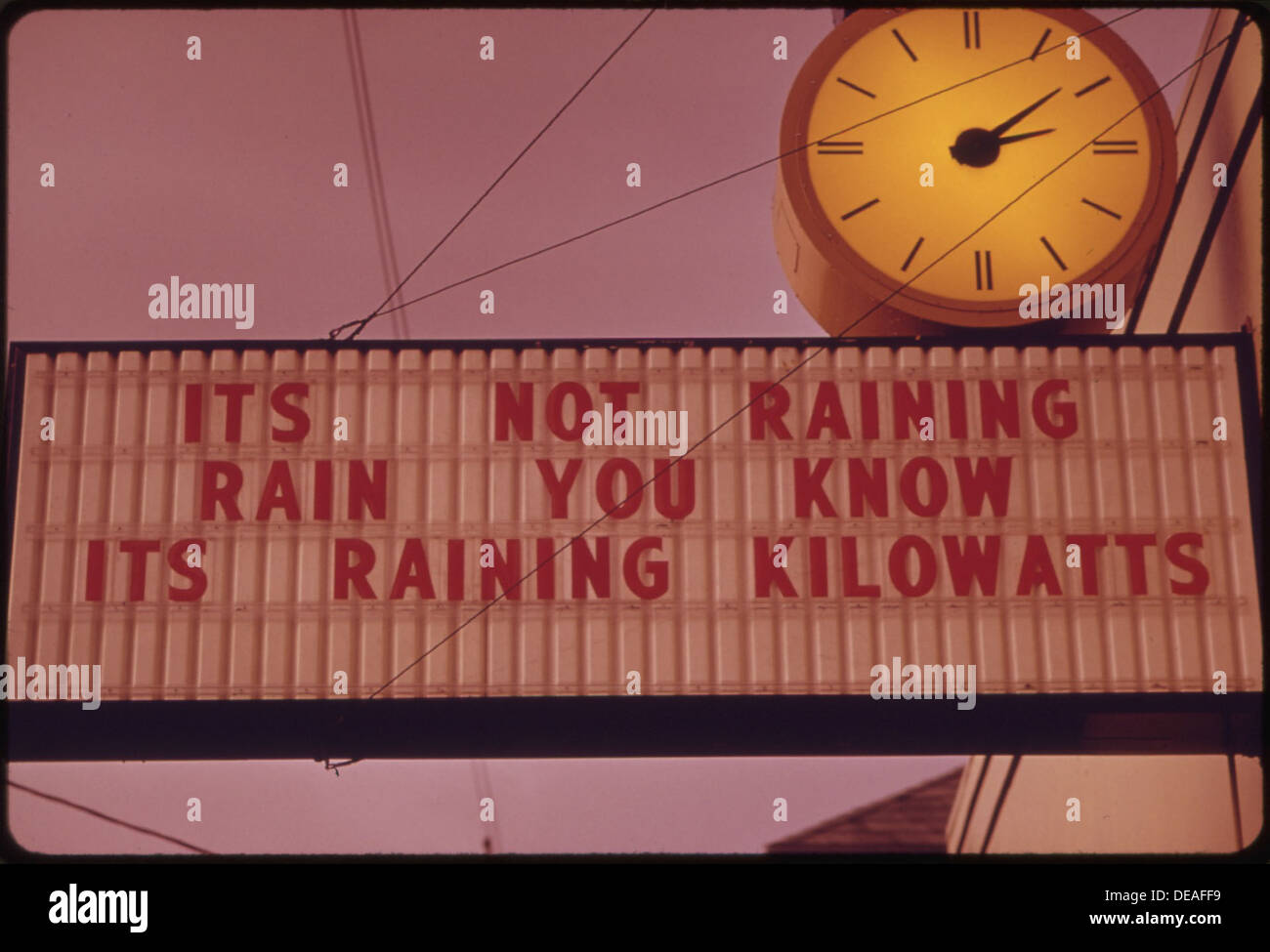 An outdoor advertising sign displays a message encouraging energy ...