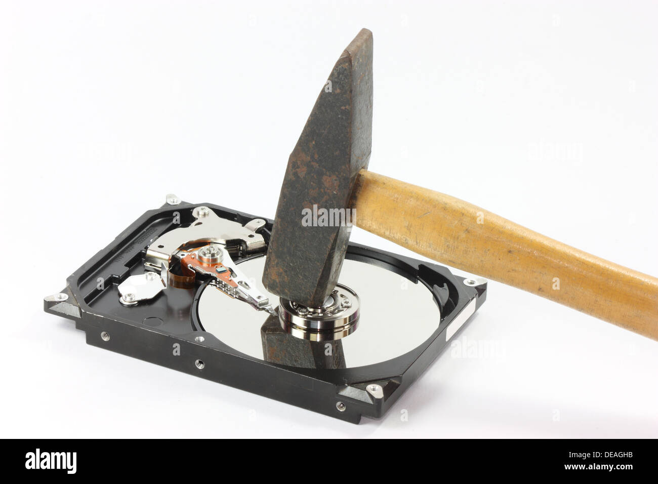 hard disk with hammer at the top on white backgound Stock Photo - Alamy