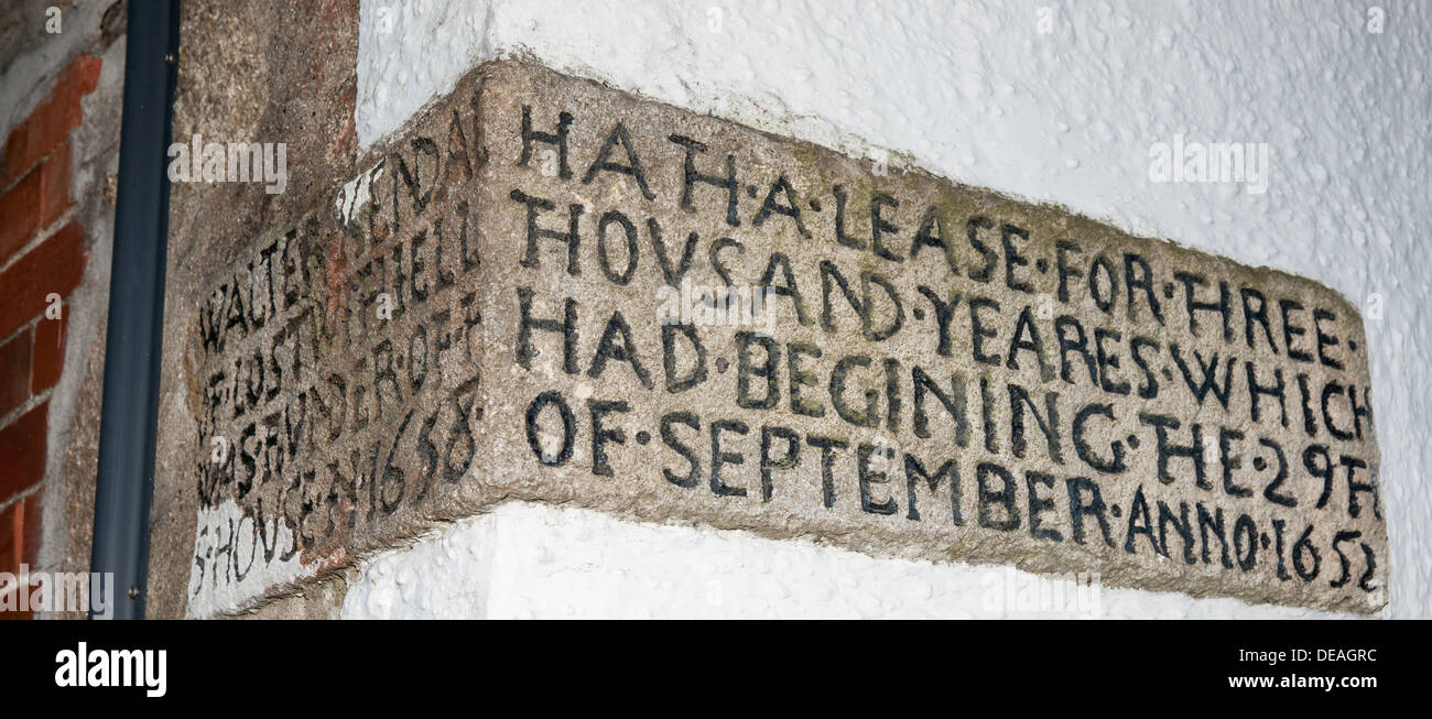 Property lease engraved in stone on building in small Cornish town ...