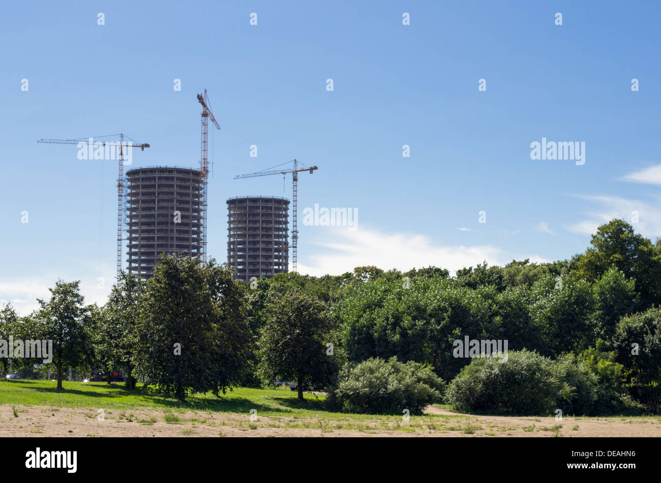 A view of two tower building construction site with tall cranes as seen ...