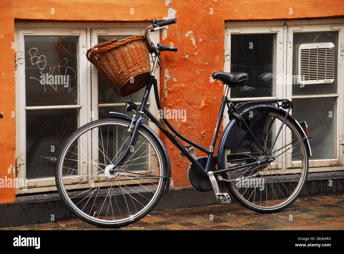 Cycle propped against wall hi-res stock photography and images - Alamy