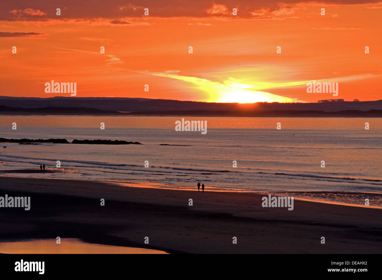 Sunset at Bamburgh, Northumberland, England, UK Stock Photo - Alamy