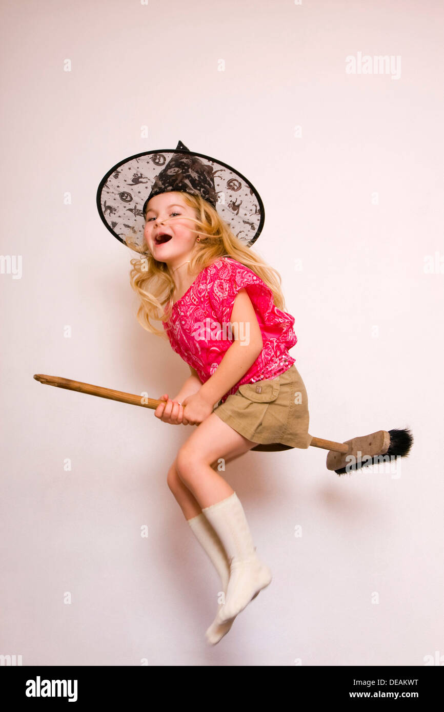 Girl broom hi-res stock photography and images - Alamy