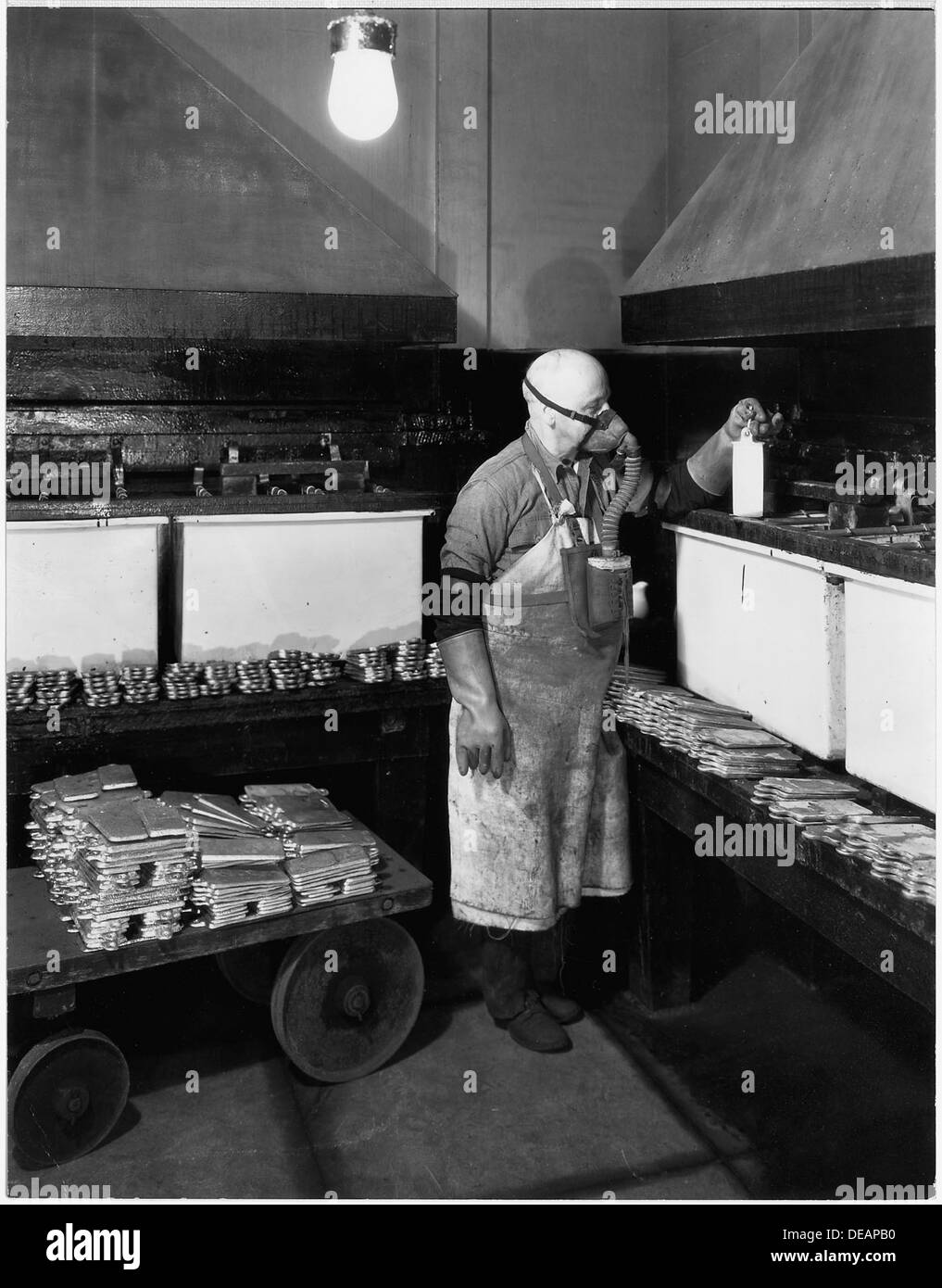 A photograph showing a worker at the San Francisco Mint's Electrolytic ...