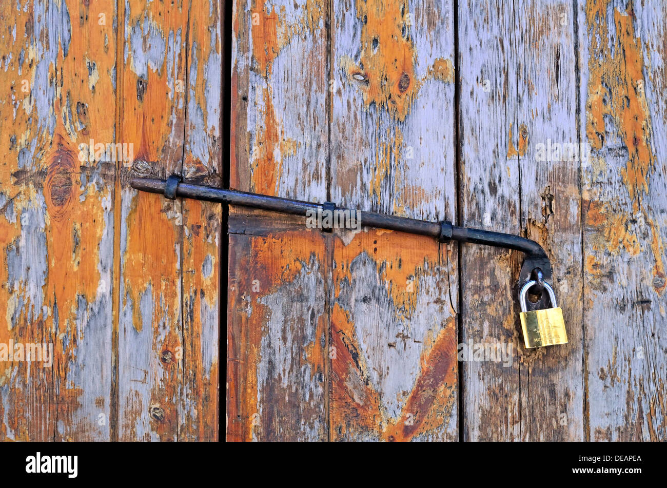 Door locked with an old rusty lock Stock Photo - Alamy
