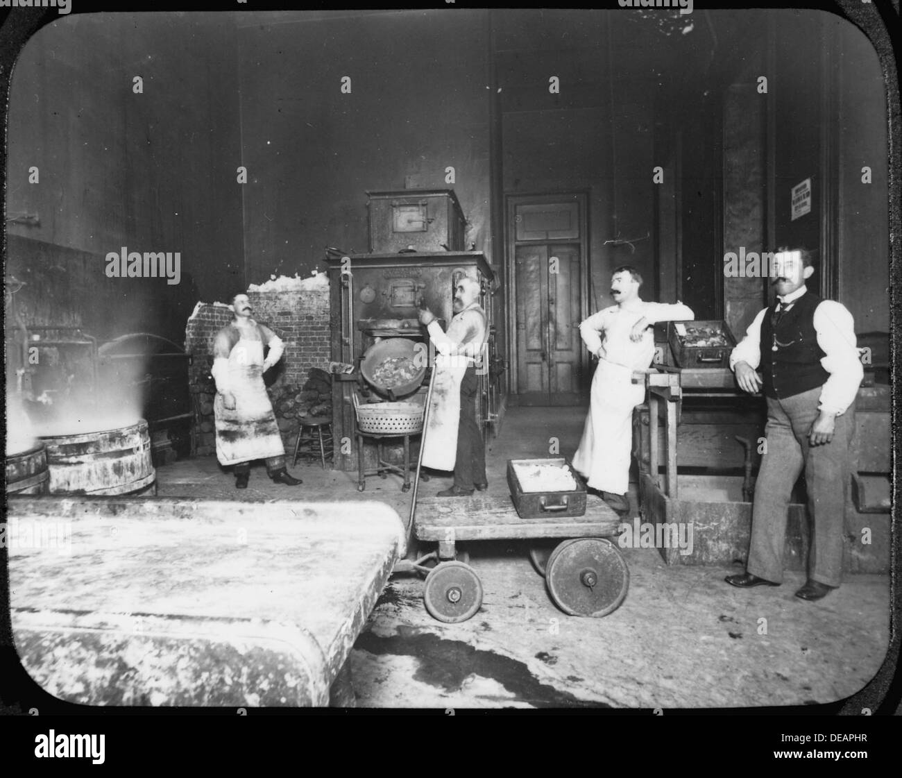Photograph of four San Francisco Mint employees in the basement of the ...