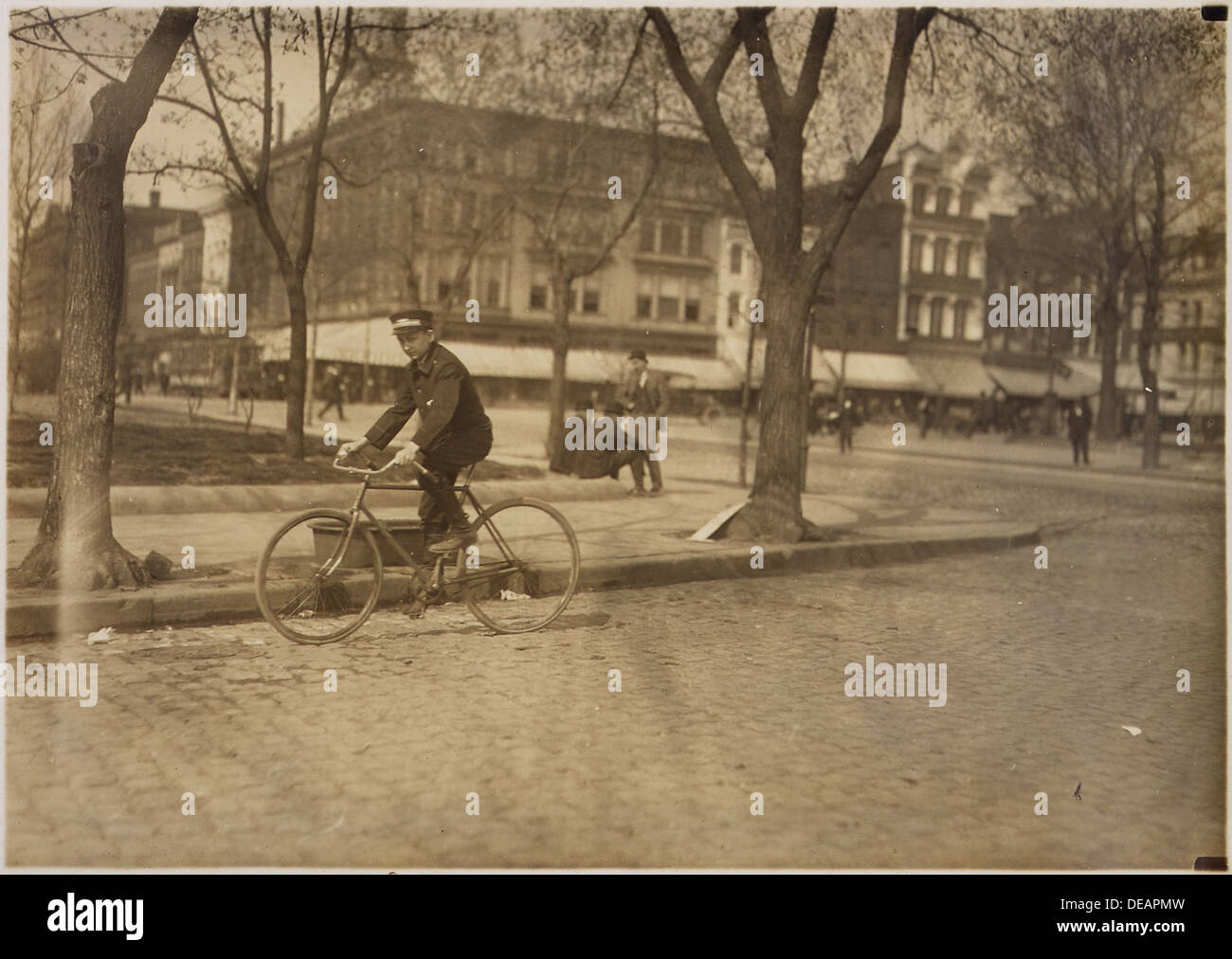 Sam Maddox, a young boy who worked for Western Union, is photographed ...
