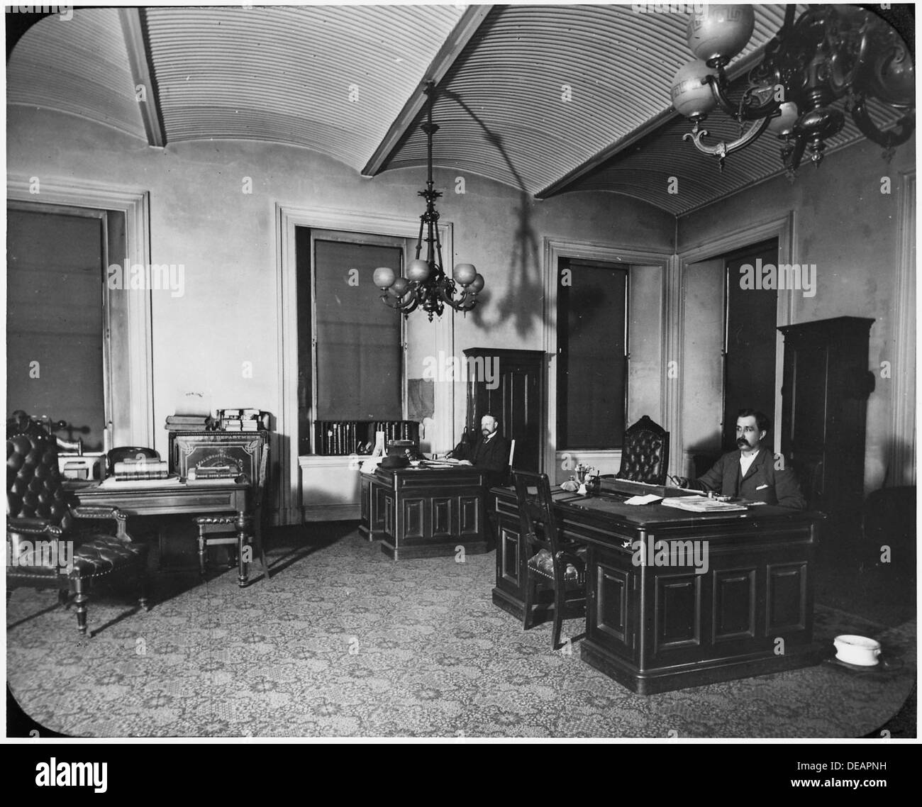 This photograph shows employees of the San Francisco Mint working in ...