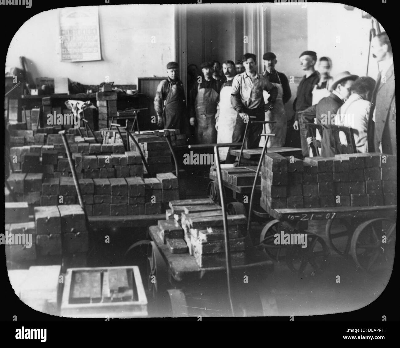 A photograph of San Francisco Mint employees transporting carts full of ...
