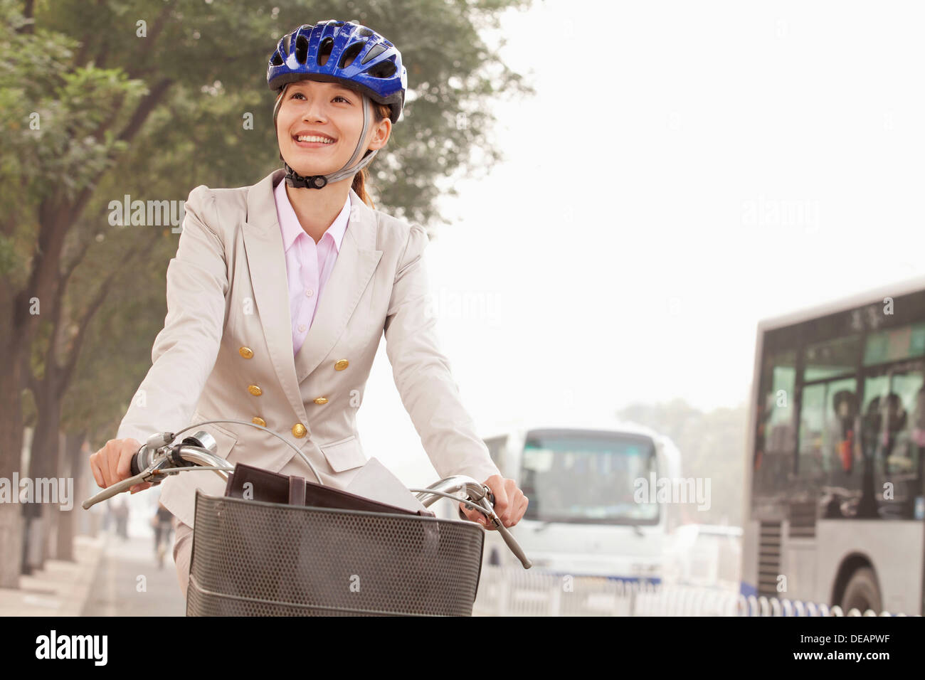 Young Business Woman commuting with a Bicycle, Beijing, China Stock ...