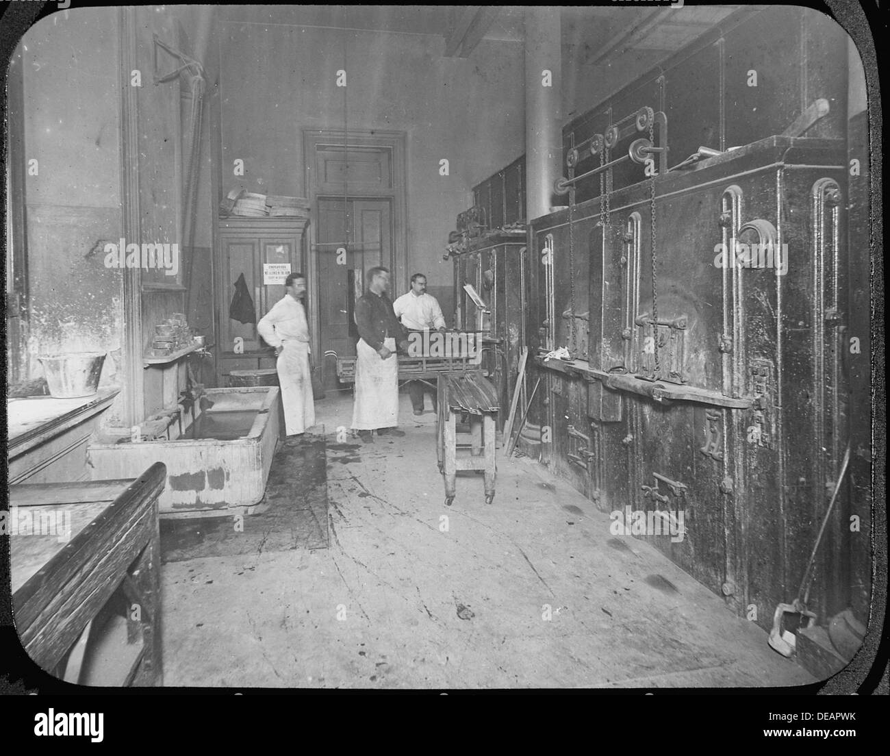 Three employees of the San Francisco Mint are photographed at the ...