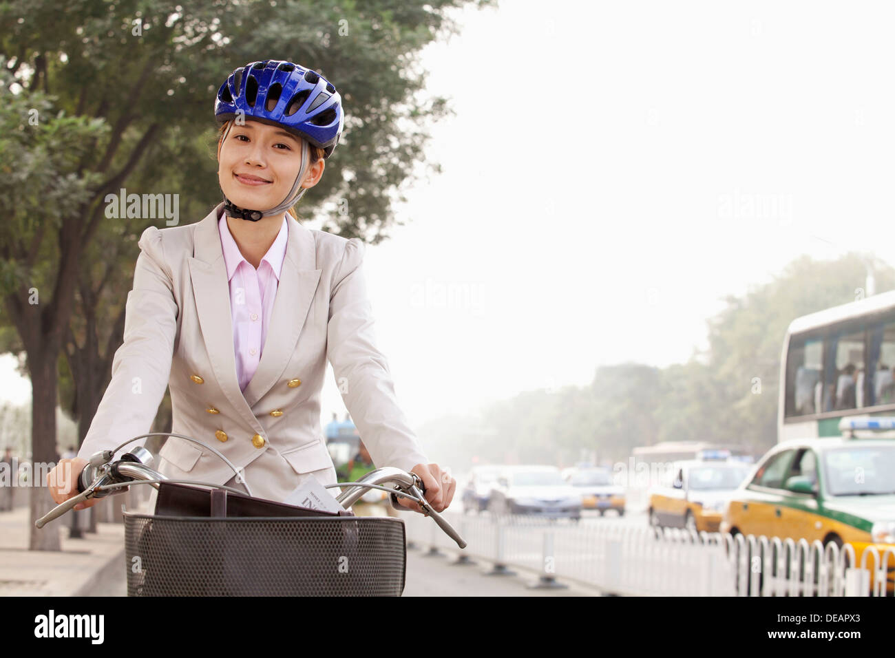 Young Business Woman commuting with a Bicycle, Beijing, China Stock ...