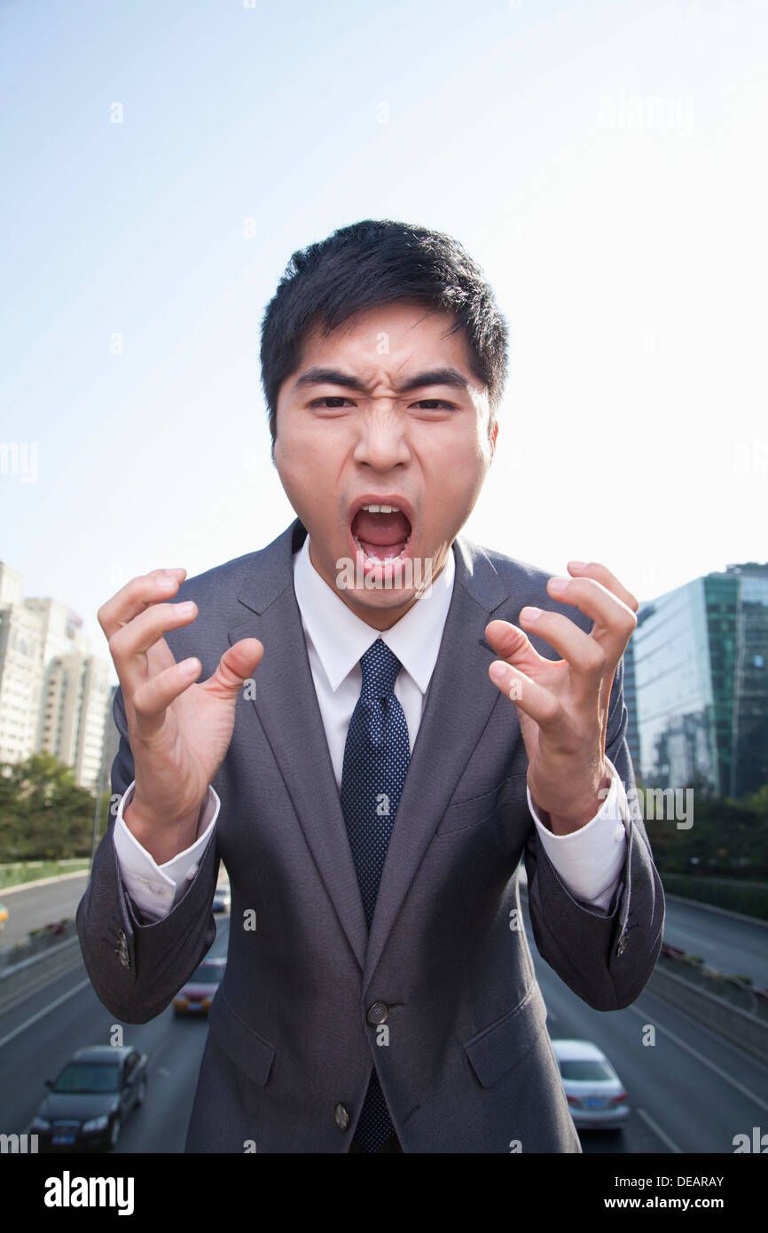 Young Angry Businessman Yelling Stock Photo - Alamy