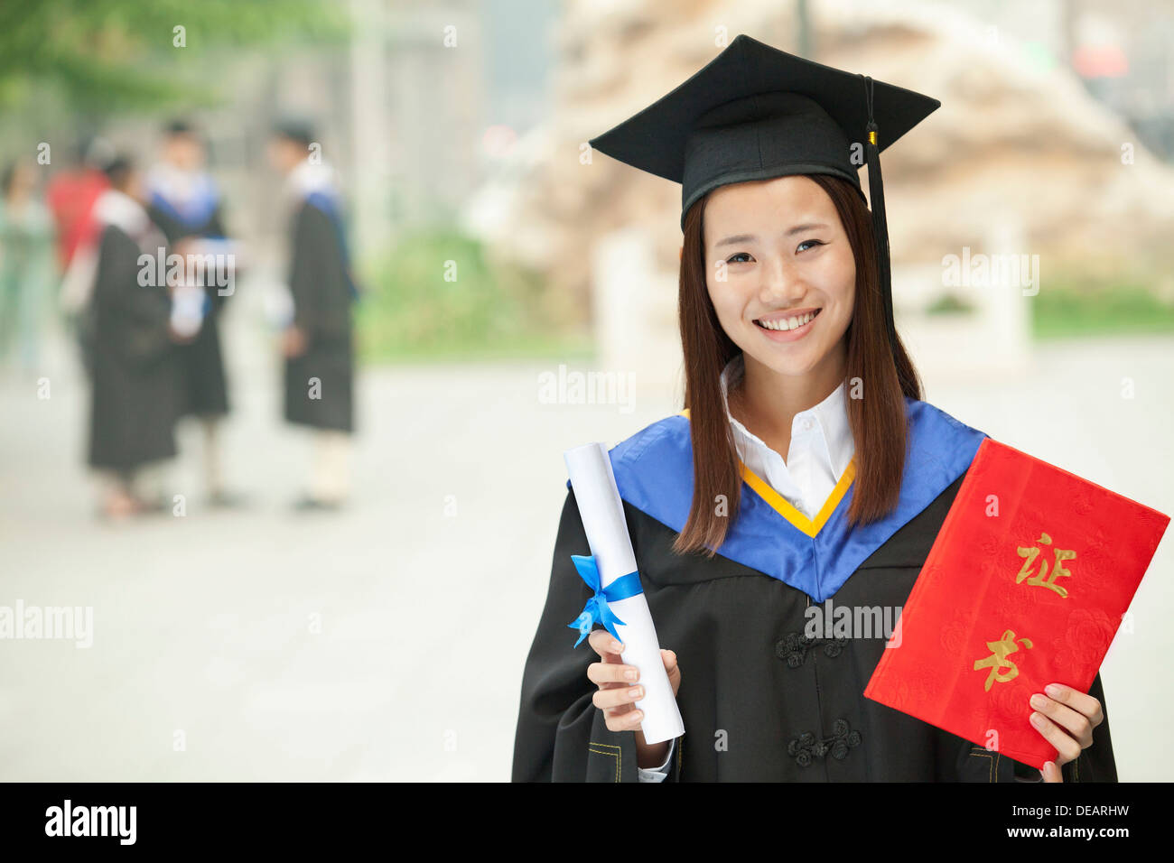 Happy Graduate with Diploma Stock Photo - Alamy