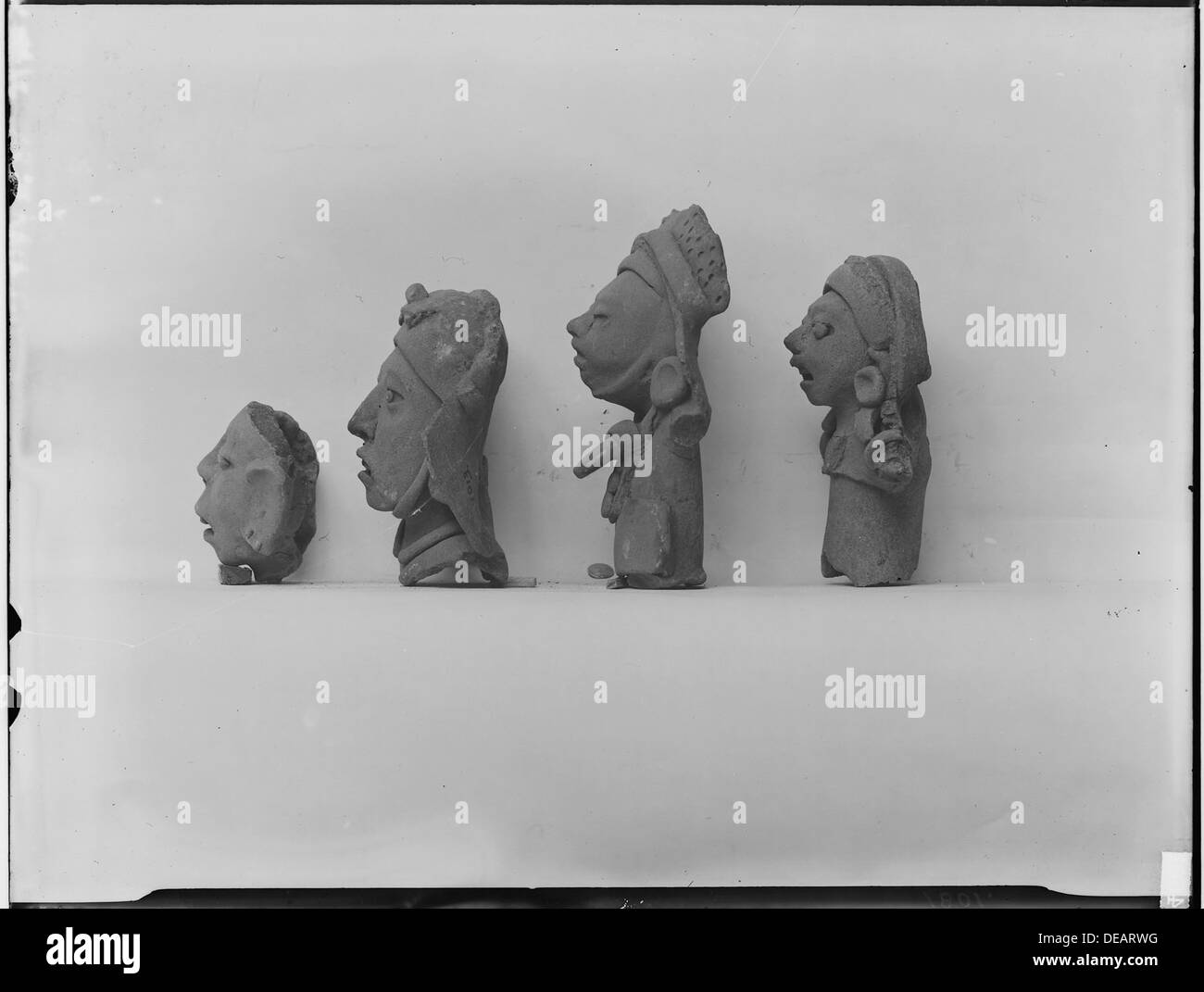 A set of pottery heads, which are traditionally crafted objects, likely ...