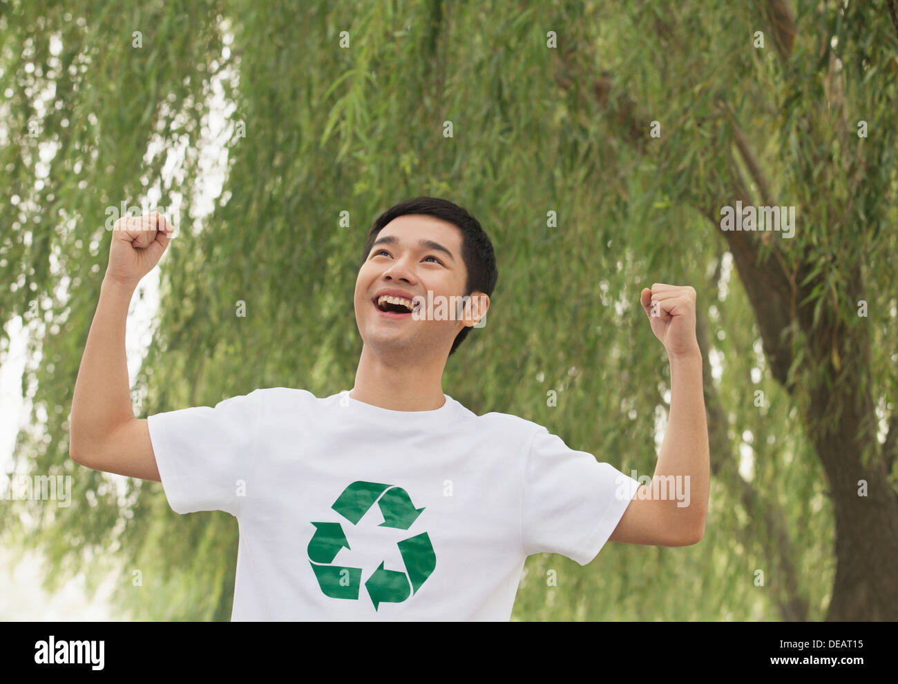 Young Man Smiling, Recycling Symbol, Beijing Stock Photo - Alamy