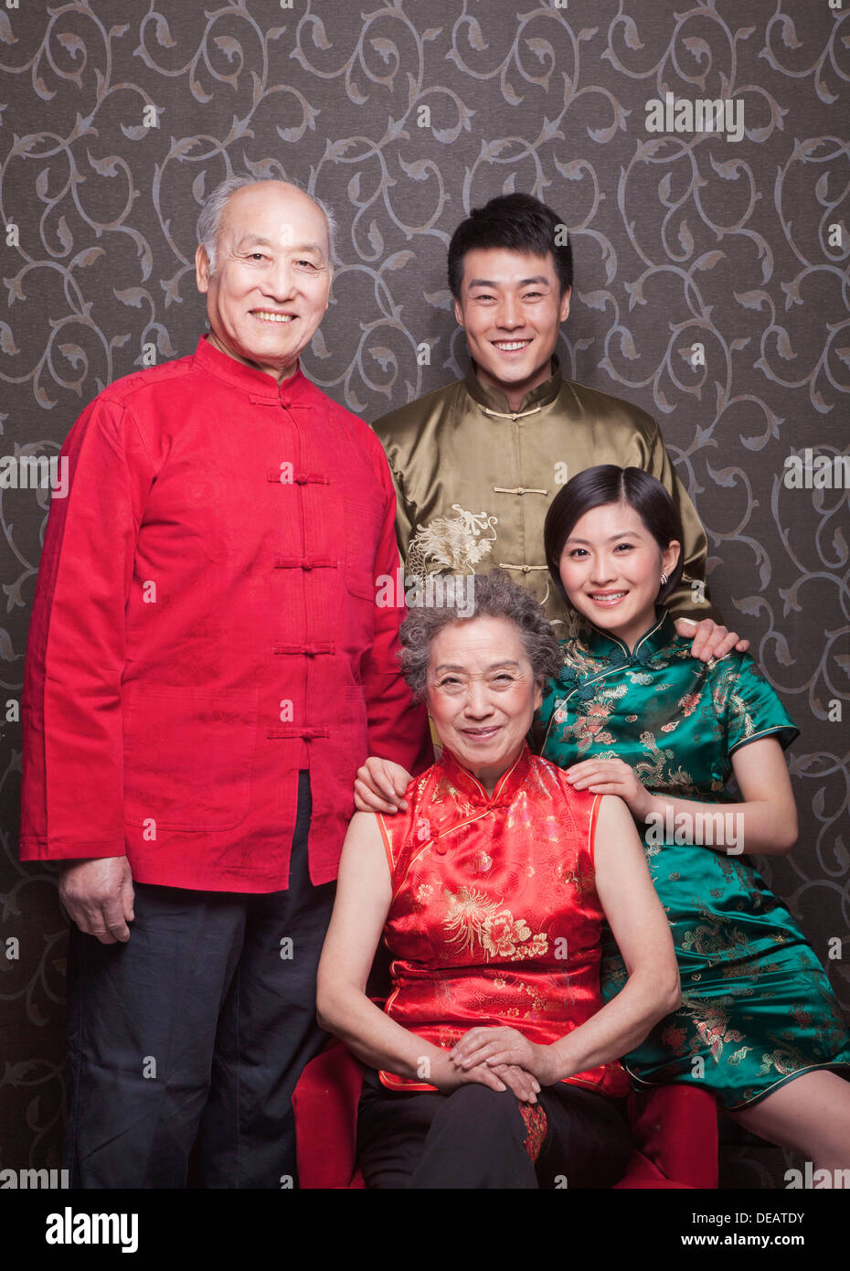 Portrait of grandparents and adult grandchildren in traditional Chinese ...