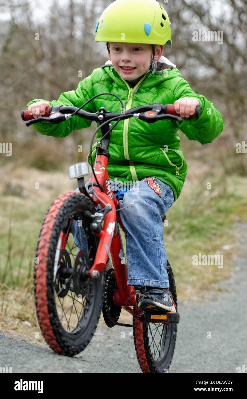 A young boy riding on a mountain bike track Stock Photo - Alamy