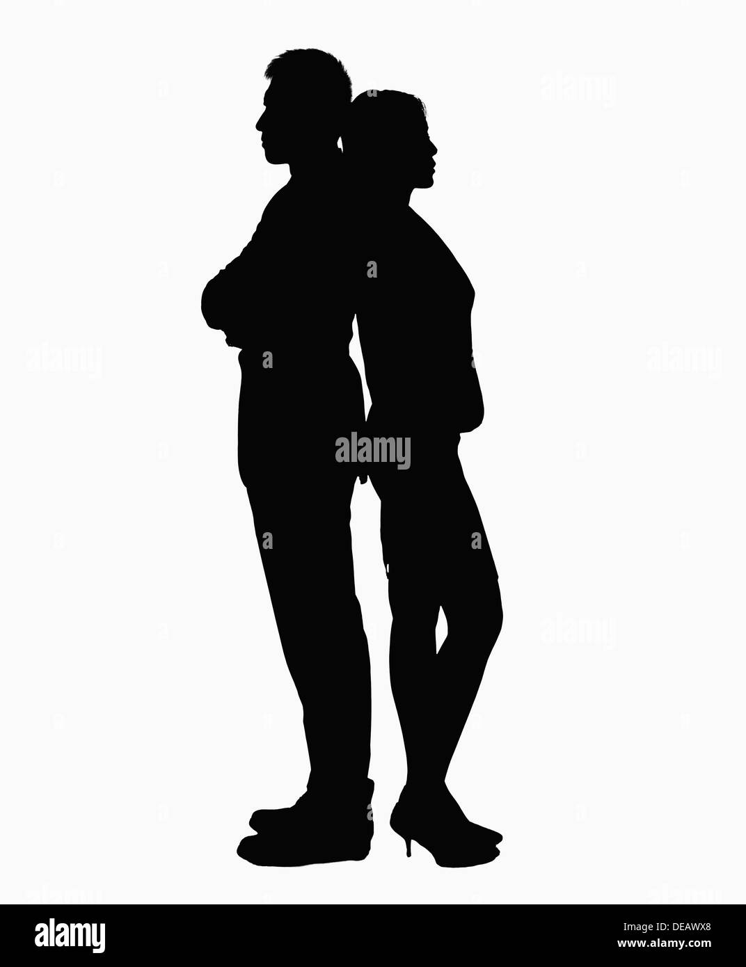 Silhouette Of Businessman And Businesswoman Standing Back To Back Stock