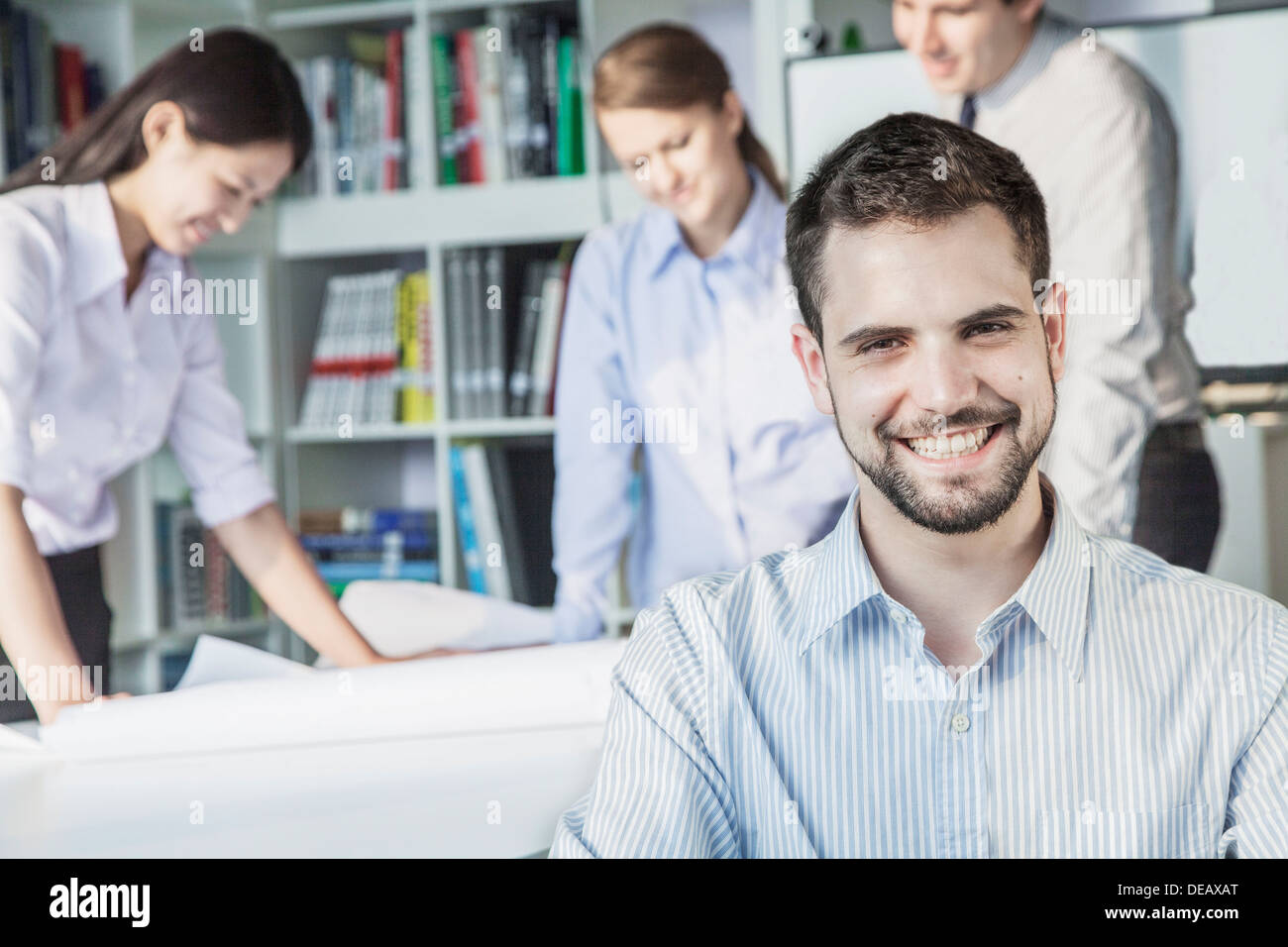 Group Architects Sitting Around Table High Resolution Stock Photography ...