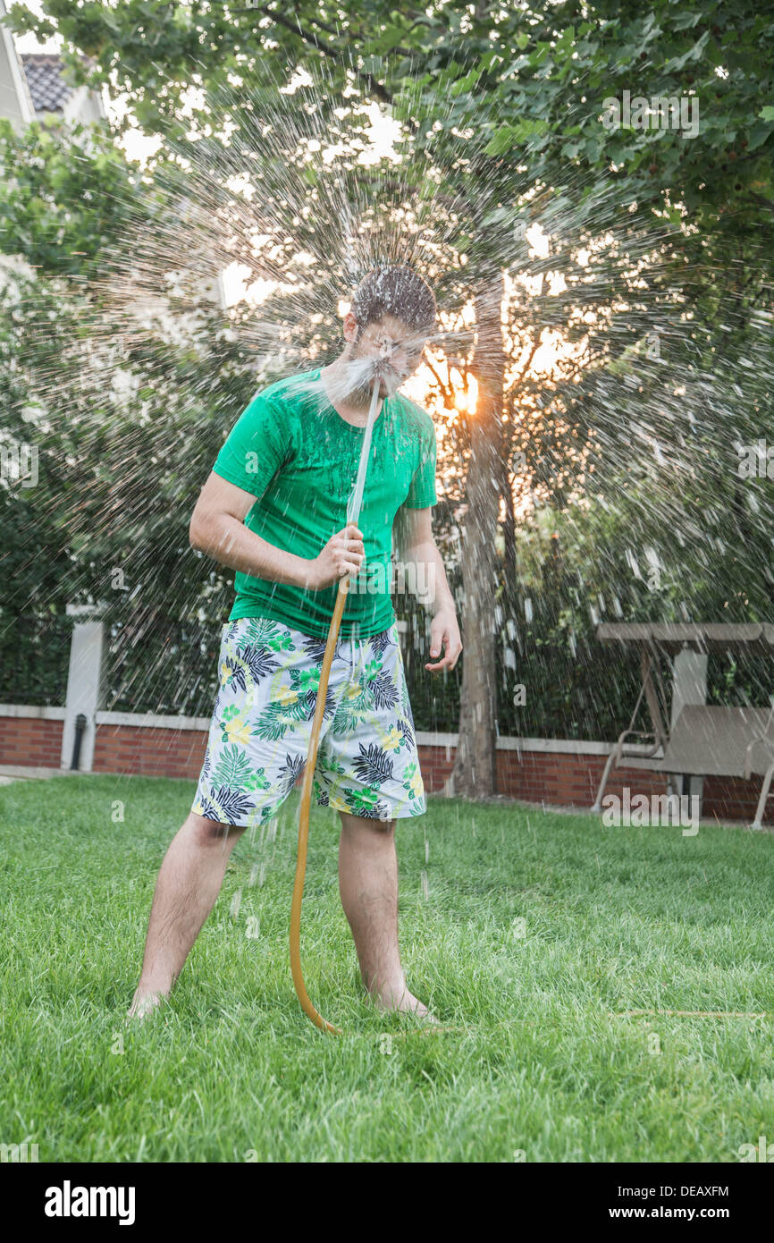 Man spraying himself hi-res stock photography and images - Alamy