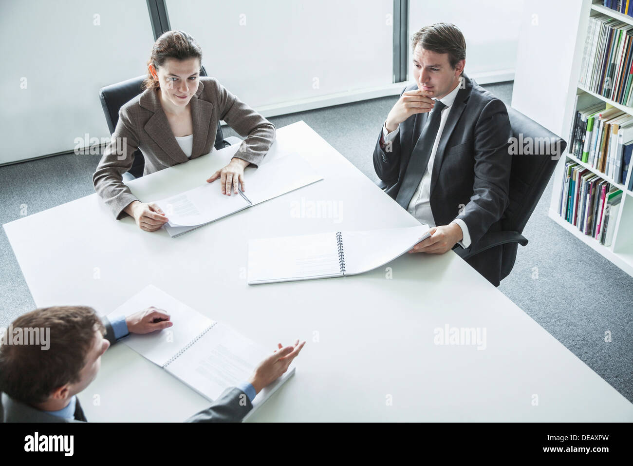 Business people sitting around table hi-res stock photography and ...