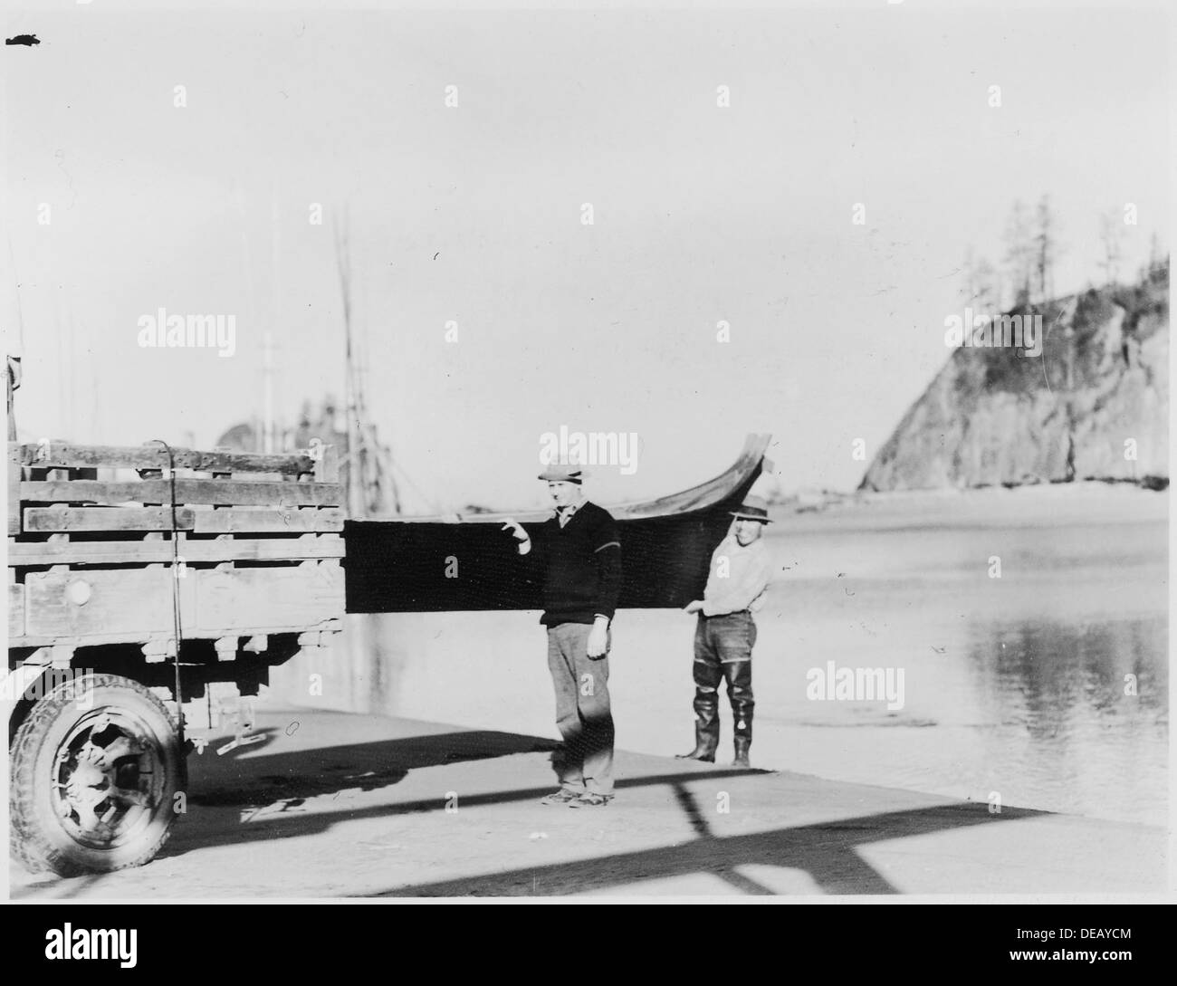 A new canoe is launched into the water at Taholah Agency. The owner is ...
