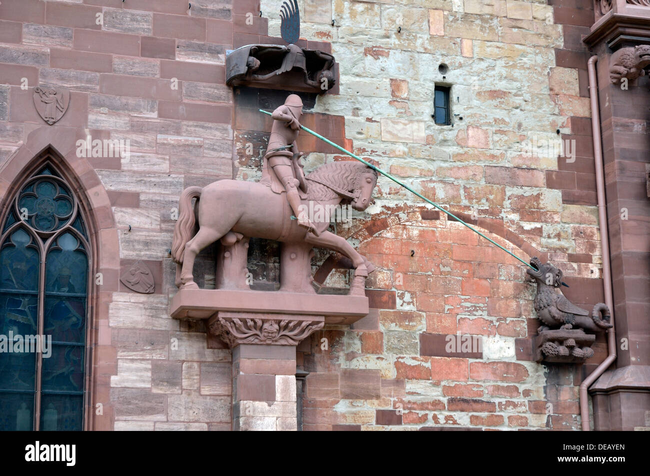 George and a dragon, carving in stone on outer wall of Basel Cathedral ...