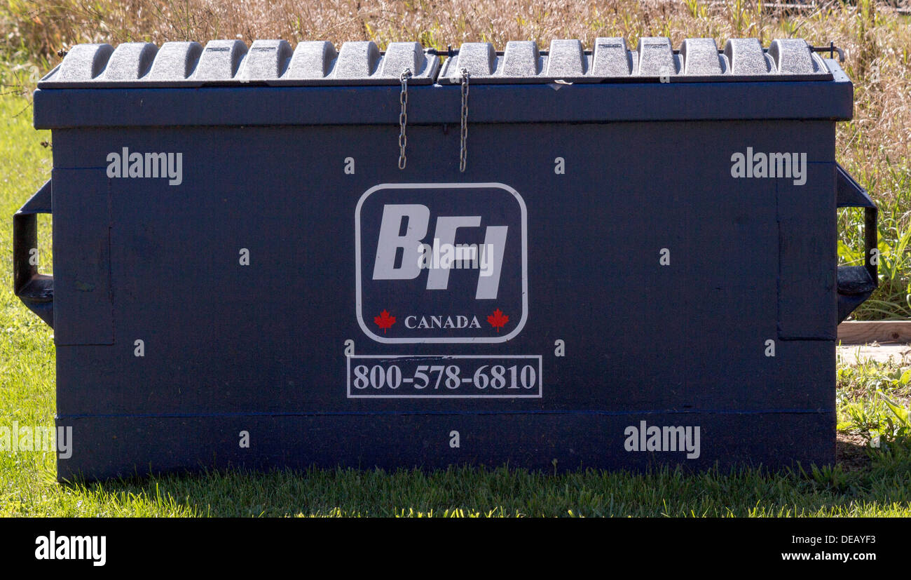 Large blue waste container bin for BFI with lid closed and chains ...