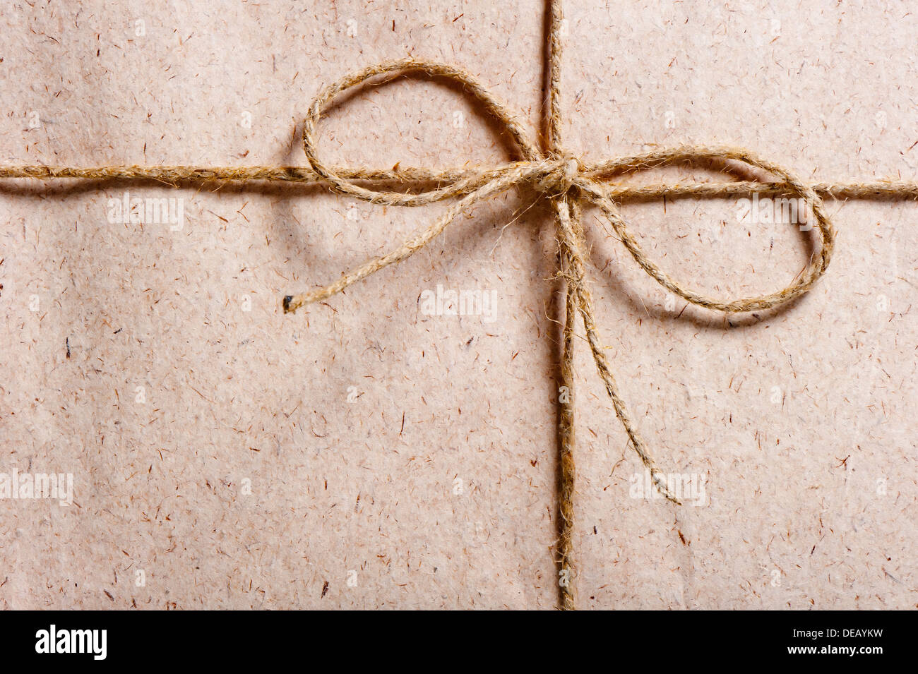 parcel wrapped in brown paper and tied with twine Stock Photo - Alamy