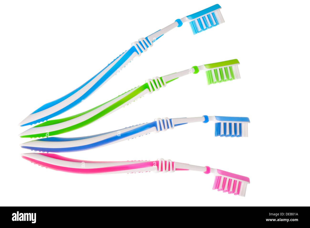 four new multi-colored toothbrushes are on a white background Stock ...