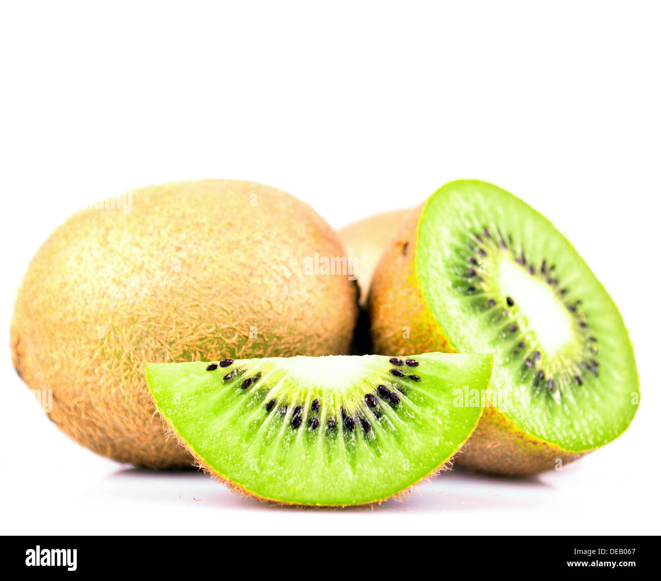 Kiwi fruit and his sliced segments isolated on white background cutout ...