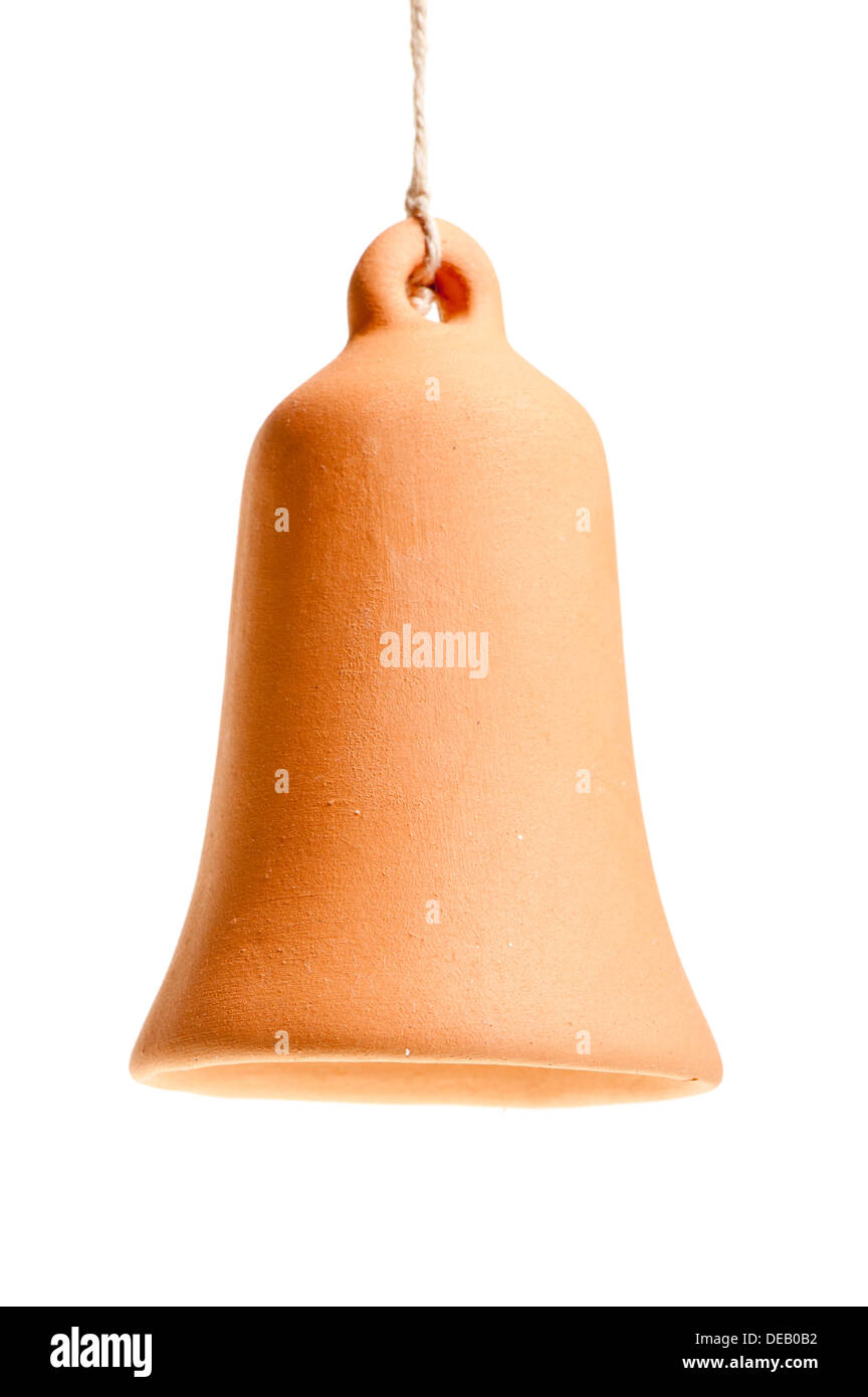 handmade clay bell hanging from a rope on a white background Stock ...
