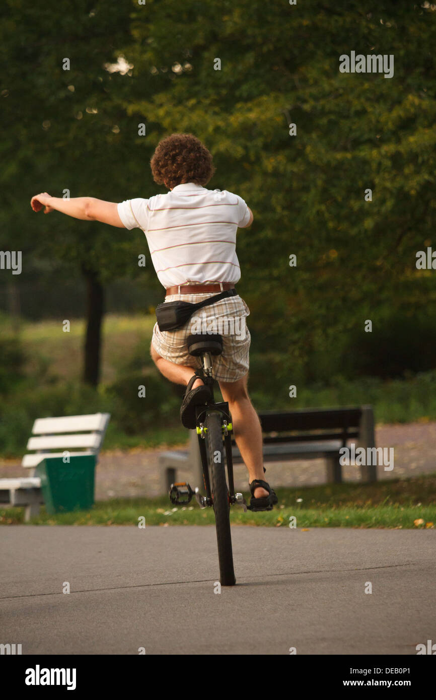 Man riding a unicycle hi-res stock photography and images - Alamy