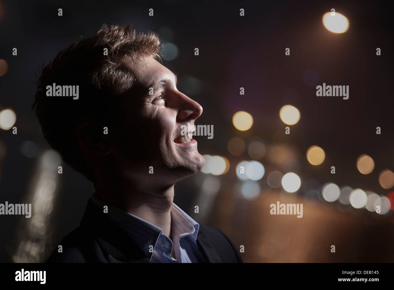 Side profile of business man smiling hi-res stock photography and ...