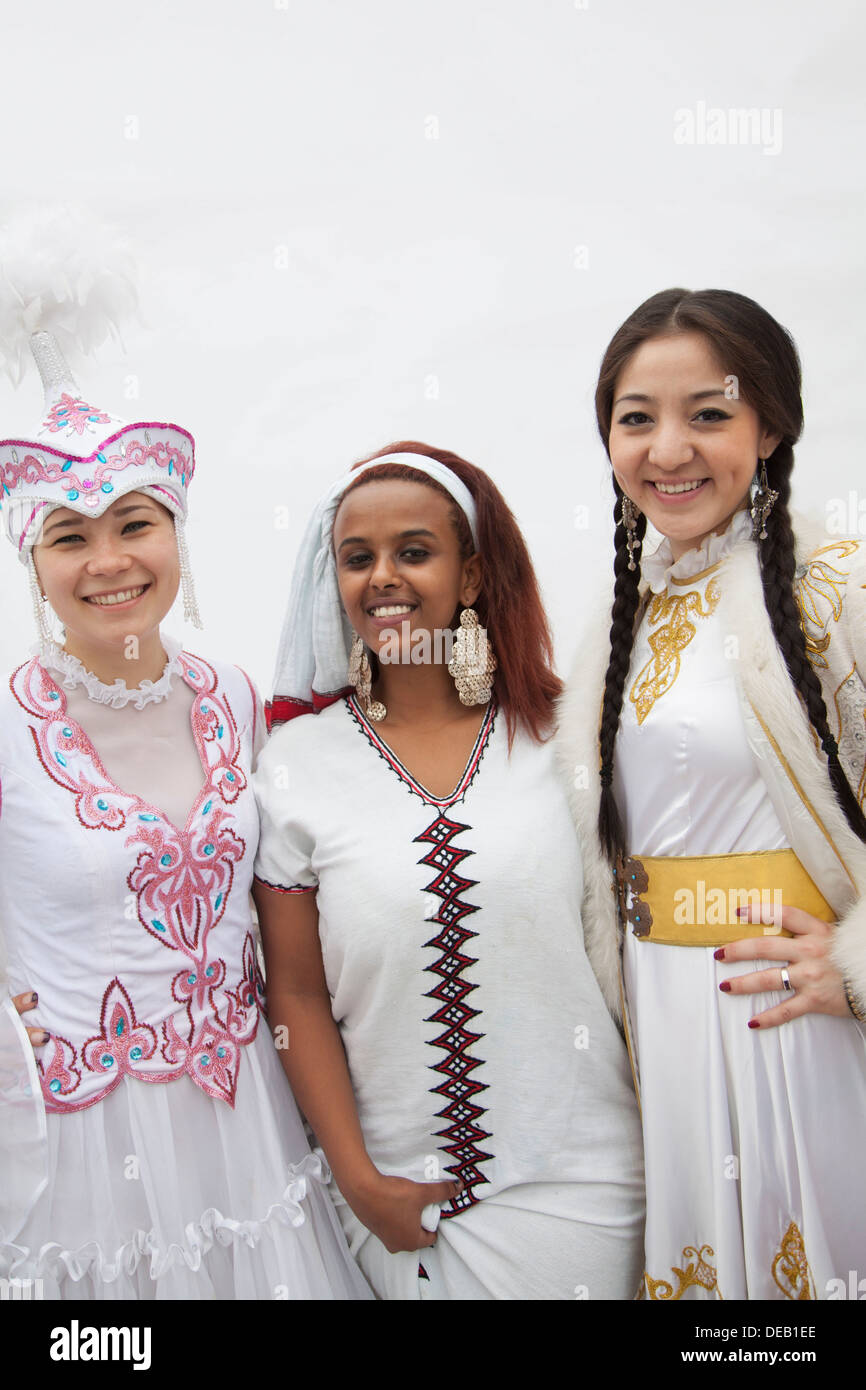 Portrait of three young multi-ethnic women in their traditional ...