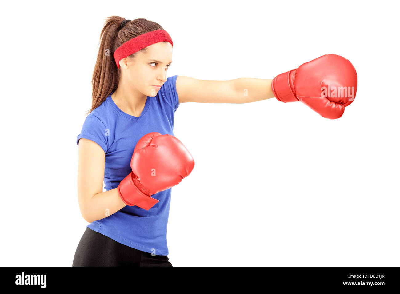 Female athlete hitting with red boxing gloves Stock Photo - Alamy